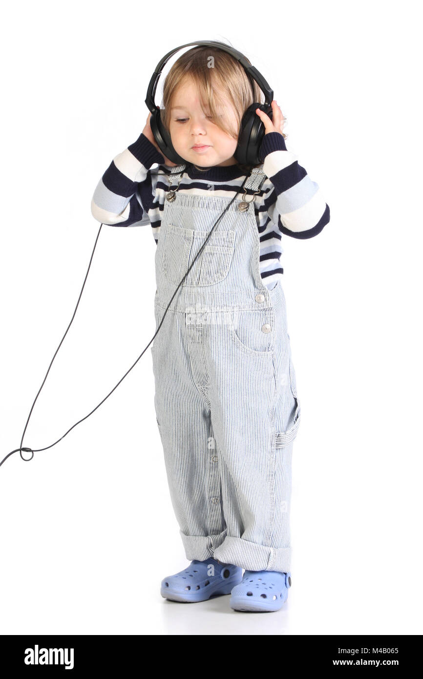beauty a little girl listening music on white background Stock Photo ...