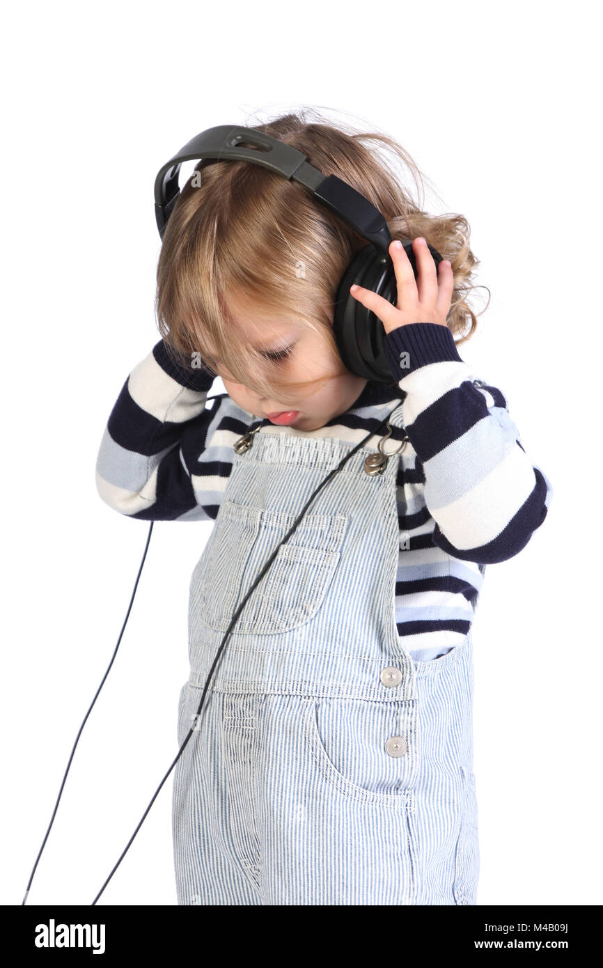 beauty a little girl listening music on white background Stock Photo ...
