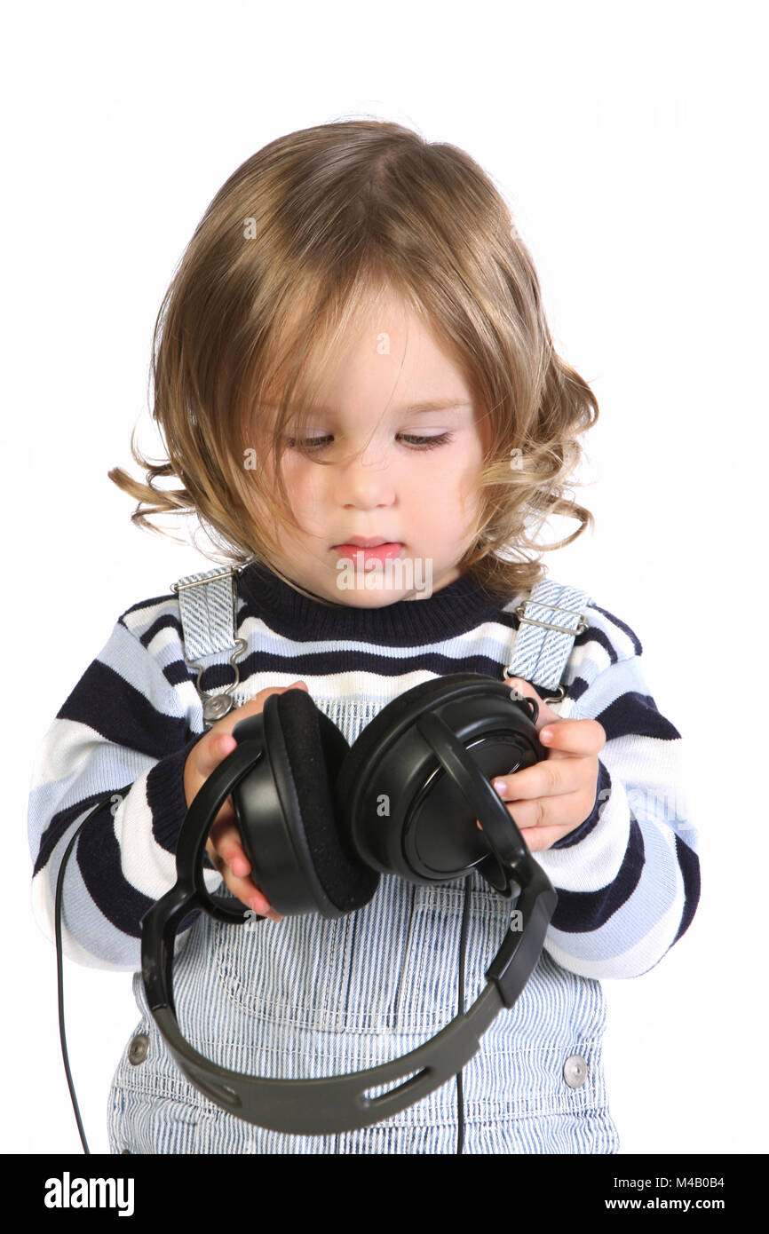 beauty a little girl listening music on white background Stock Photo ...