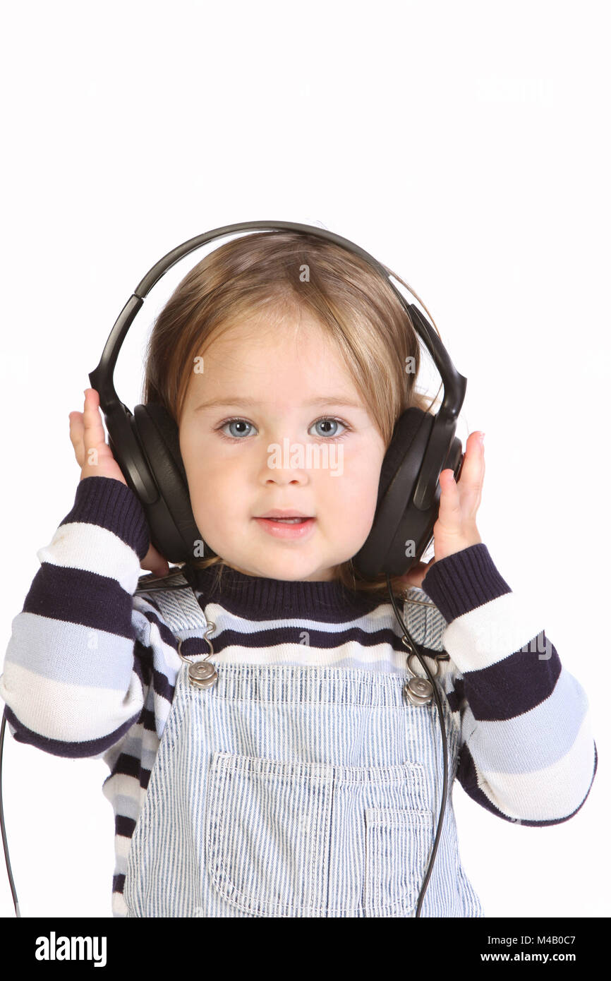 beauty a little girl listening music on white background Stock Photo ...