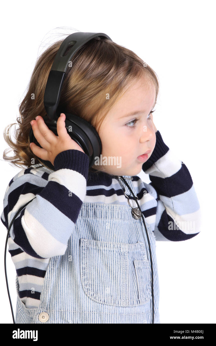 beauty a little girl listening music on white background Stock Photo ...