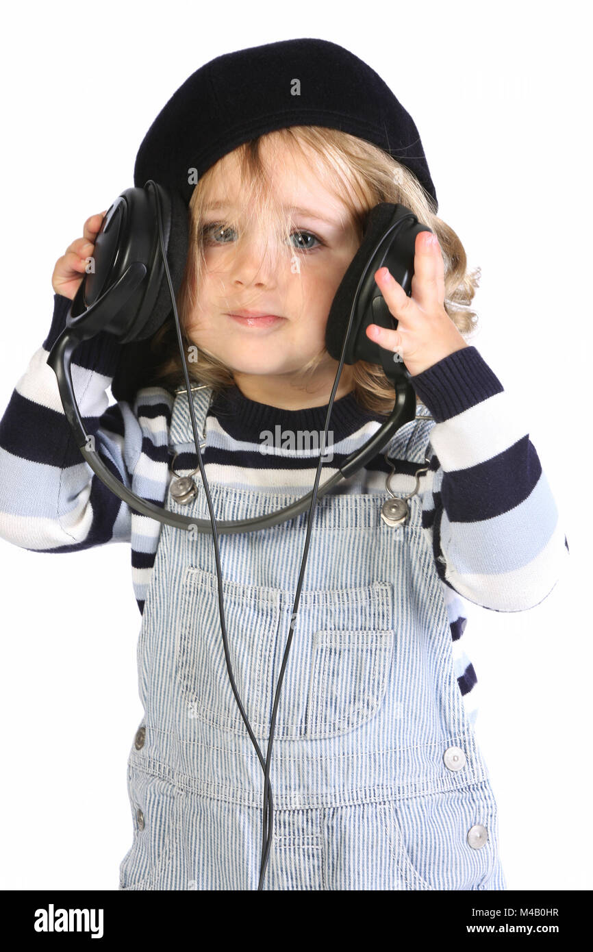 beauty a little girl listening music on white background Stock Photo ...