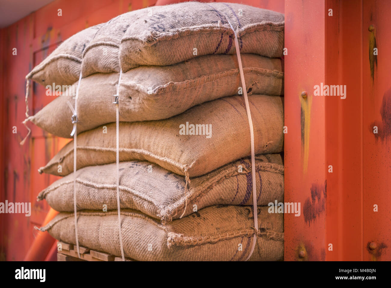 Jute sacks stacked in a warehouse Stock Photo - Alamy