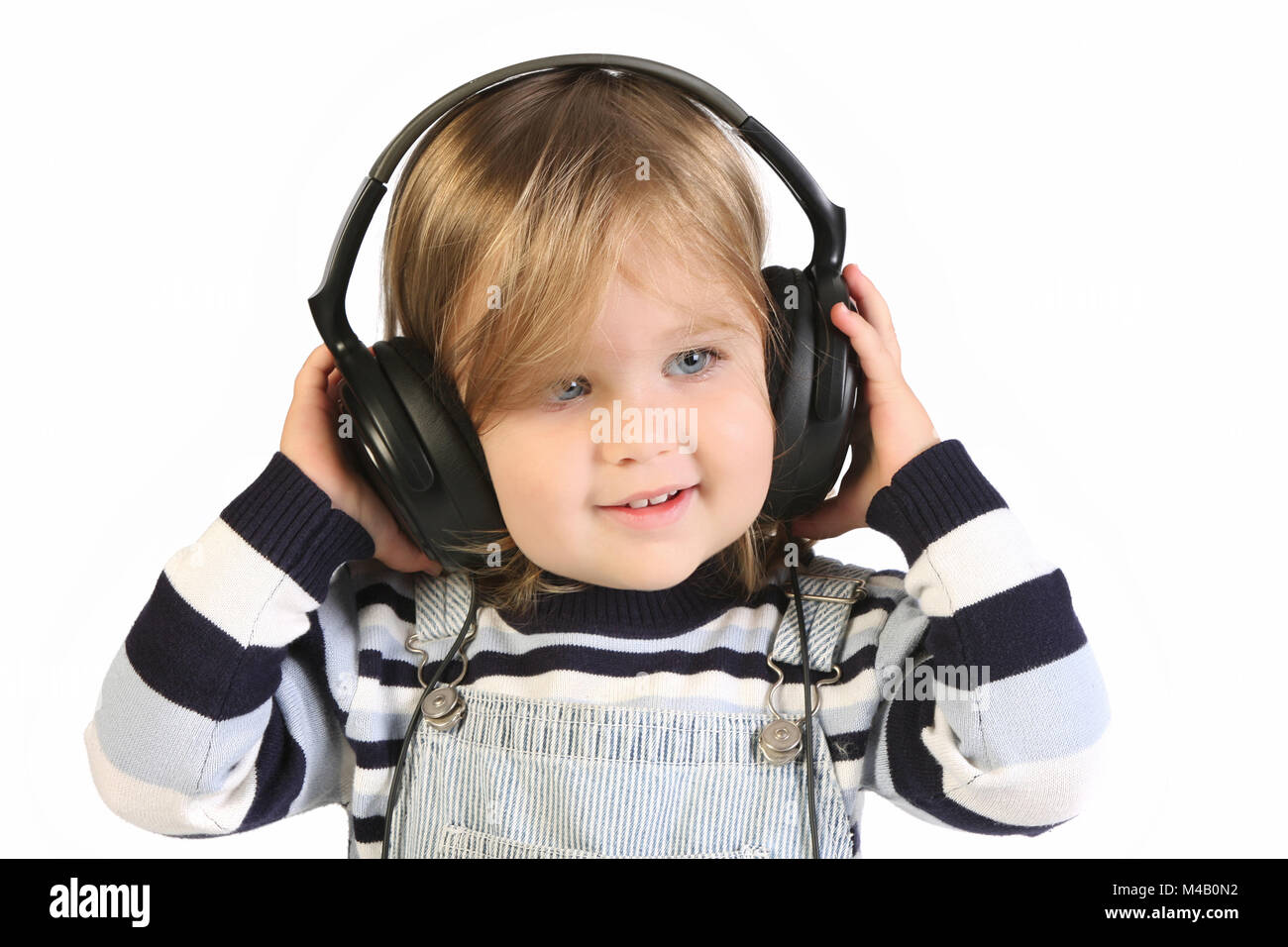 beauty a little girl listening music on white background Stock Photo ...