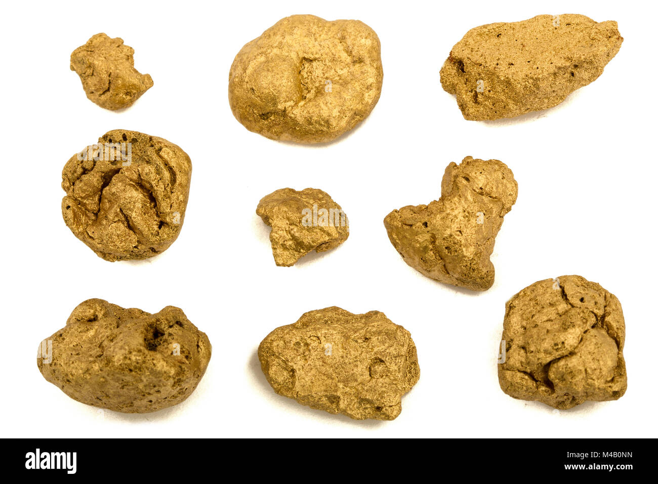 Gold nuggets, isolated on white background Stock Photo - Alamy