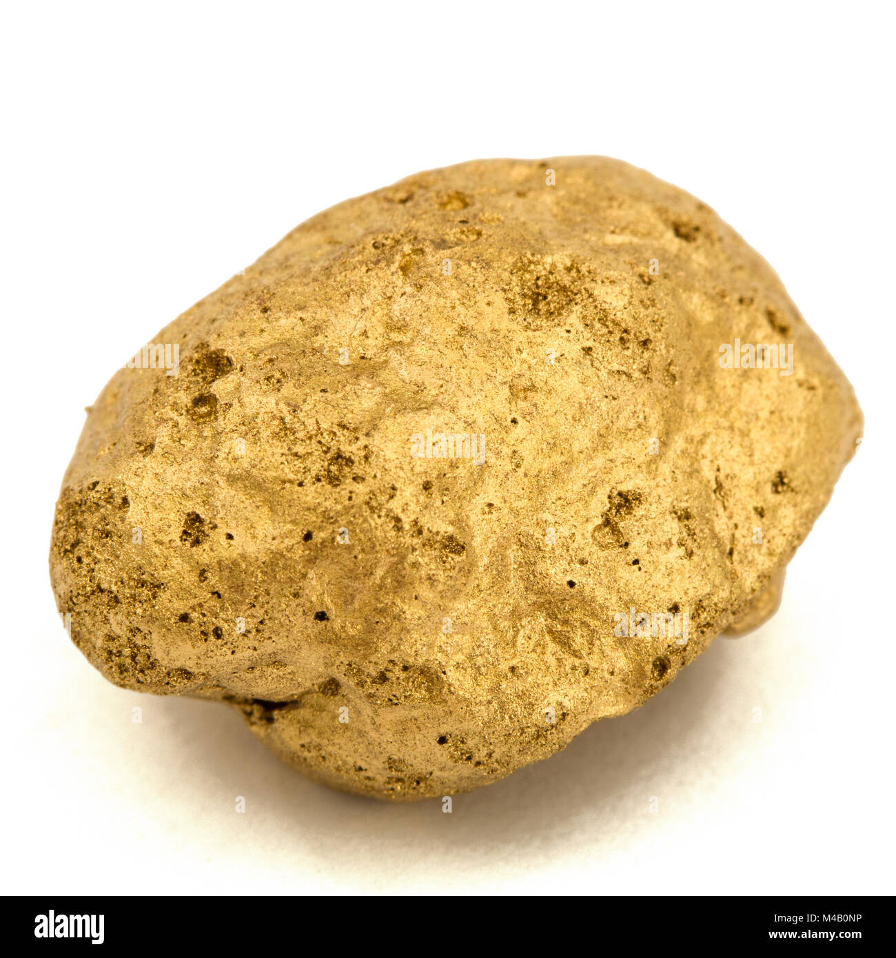 Gold nugget, isolated on white background Stock Photo - Alamy