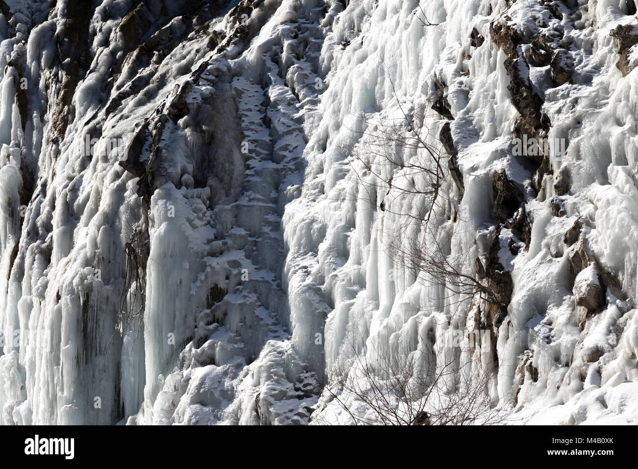 Big icy mountain waterfall at cold sun day. Winter in Georgia Stock ...