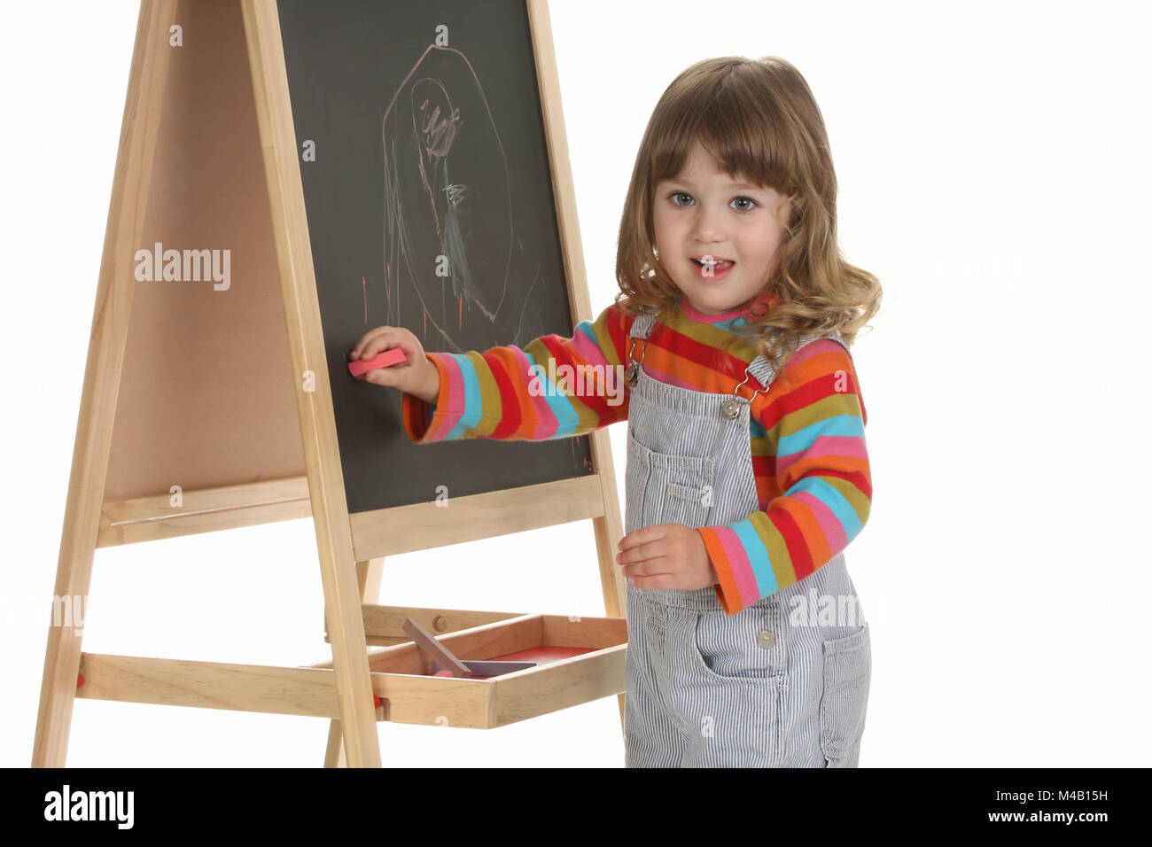 beauty a little girl writing on a blackboard Stock Photo - Alamy