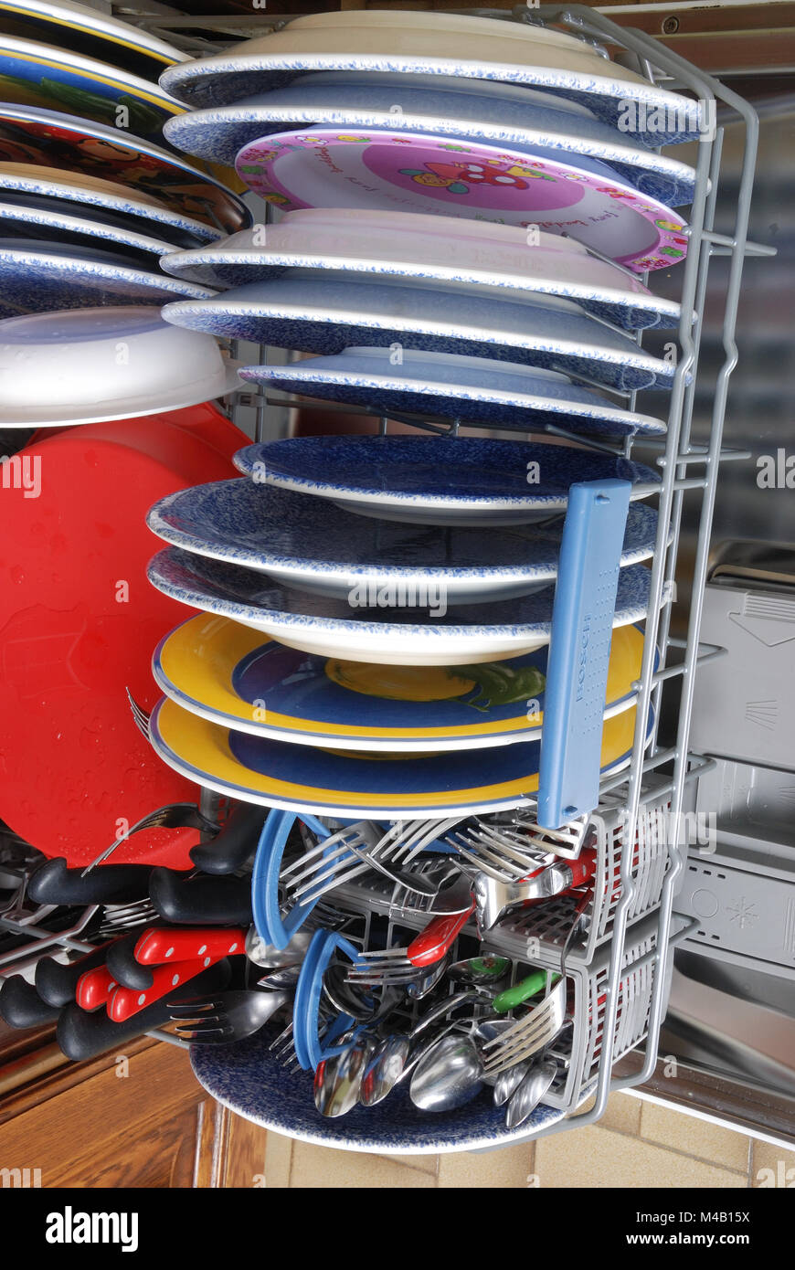 Dishwasher full of clean dishes Stock Photo - Alamy