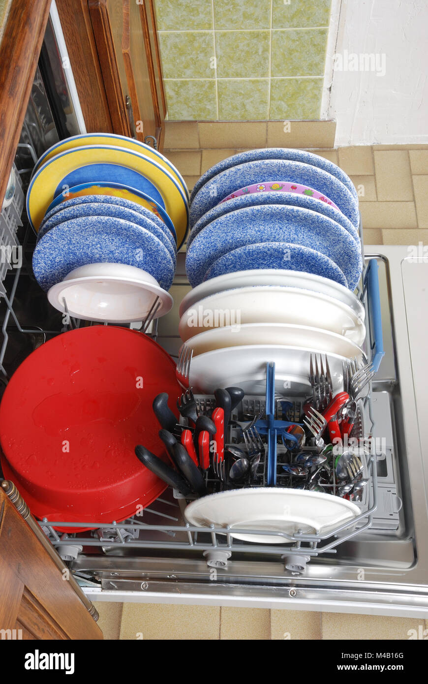 Dishwasher full of clean dishes Stock Photo - Alamy