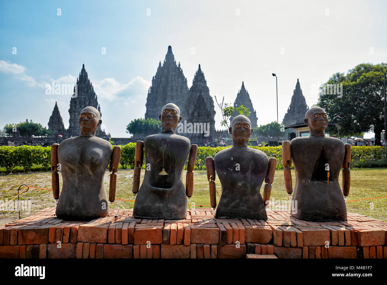Statues at the entrance to the Prambanan Hindu Temple Compound. Special ...