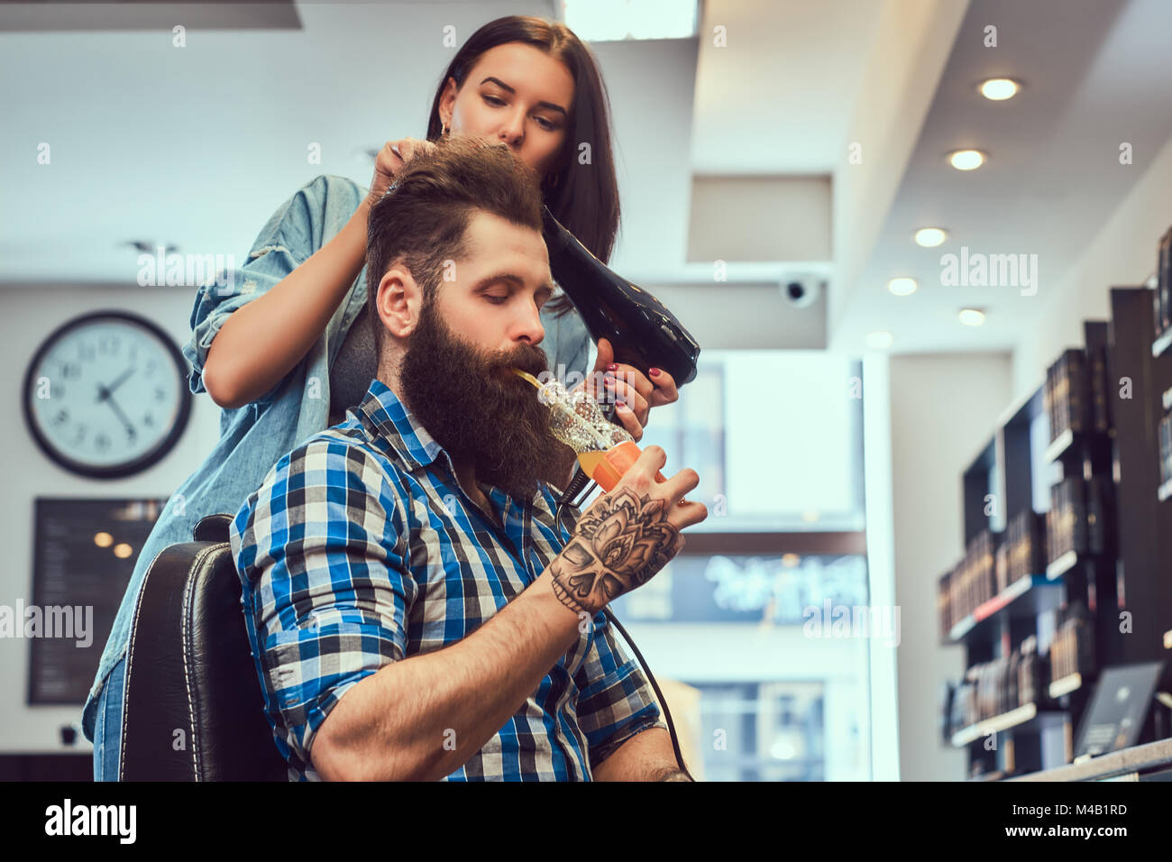 Handsome bearded man in the barbershop Stock Photo - Alamy