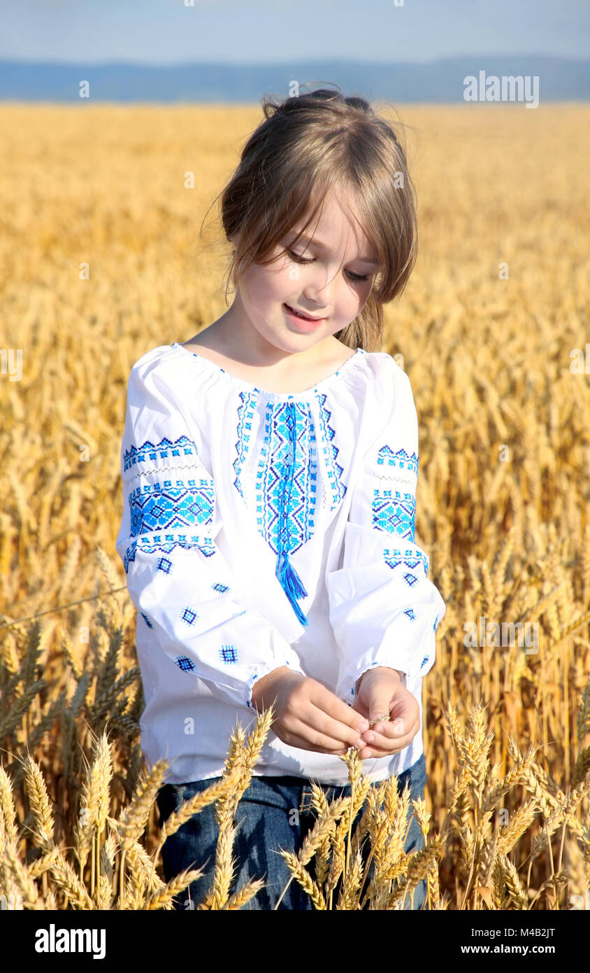 small rural girl on wheat field Stock Photo - Alamy