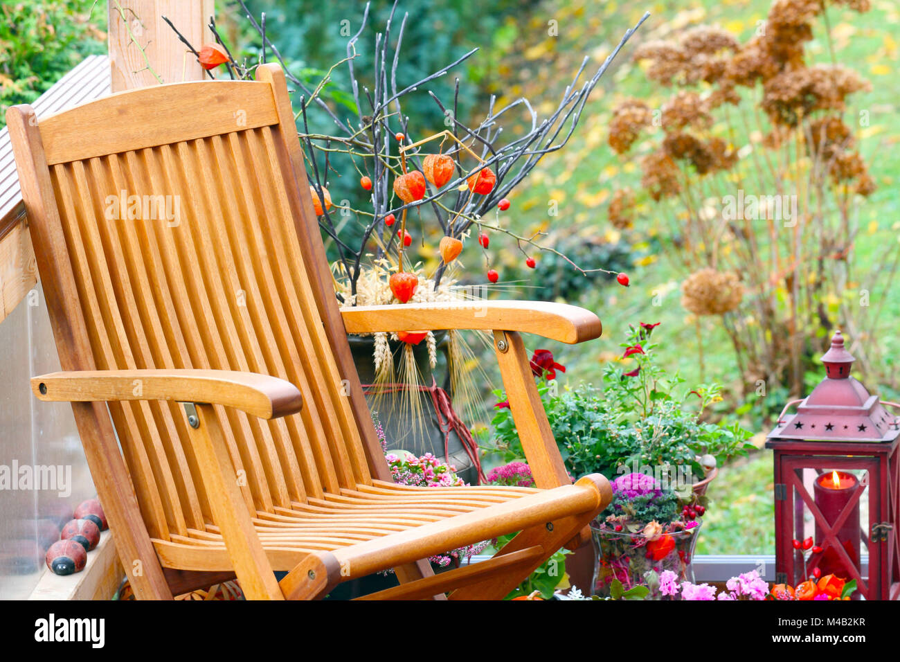 Comfortable seat on patio in autumn Stock Photo - Alamy