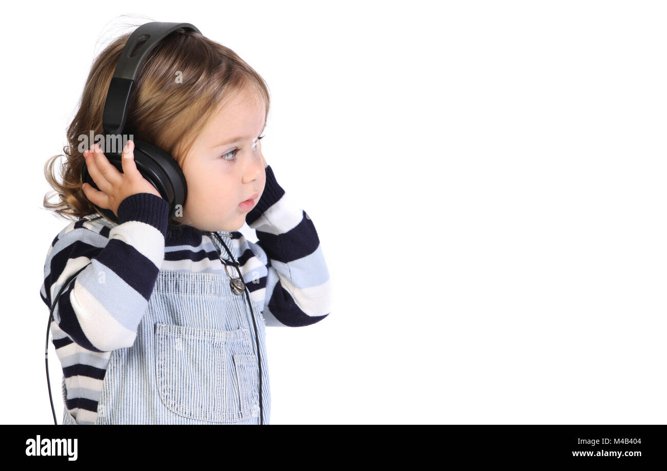 beauty a little girl listening music on white background Stock Photo ...