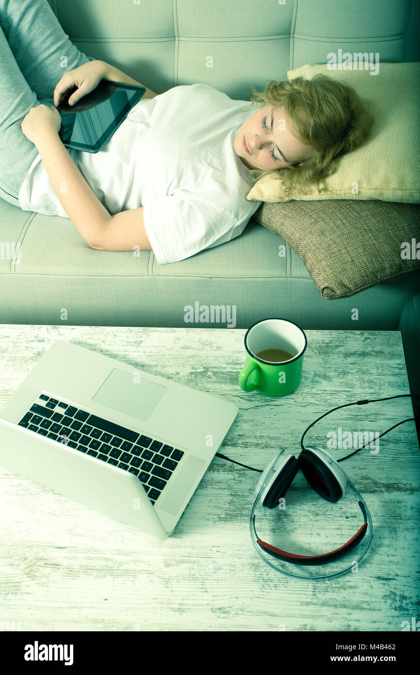 Young plus size woman fallen asleep in the living room Stock Photo - Alamy