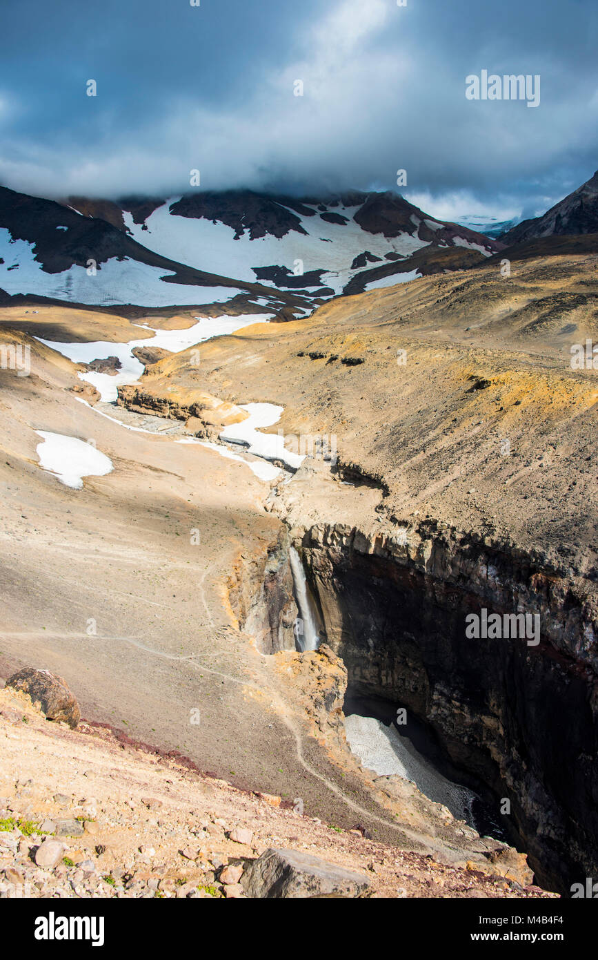 Half frozen waterfall below Mutnovsky volcano,Kamchatka,Russia Stock ...