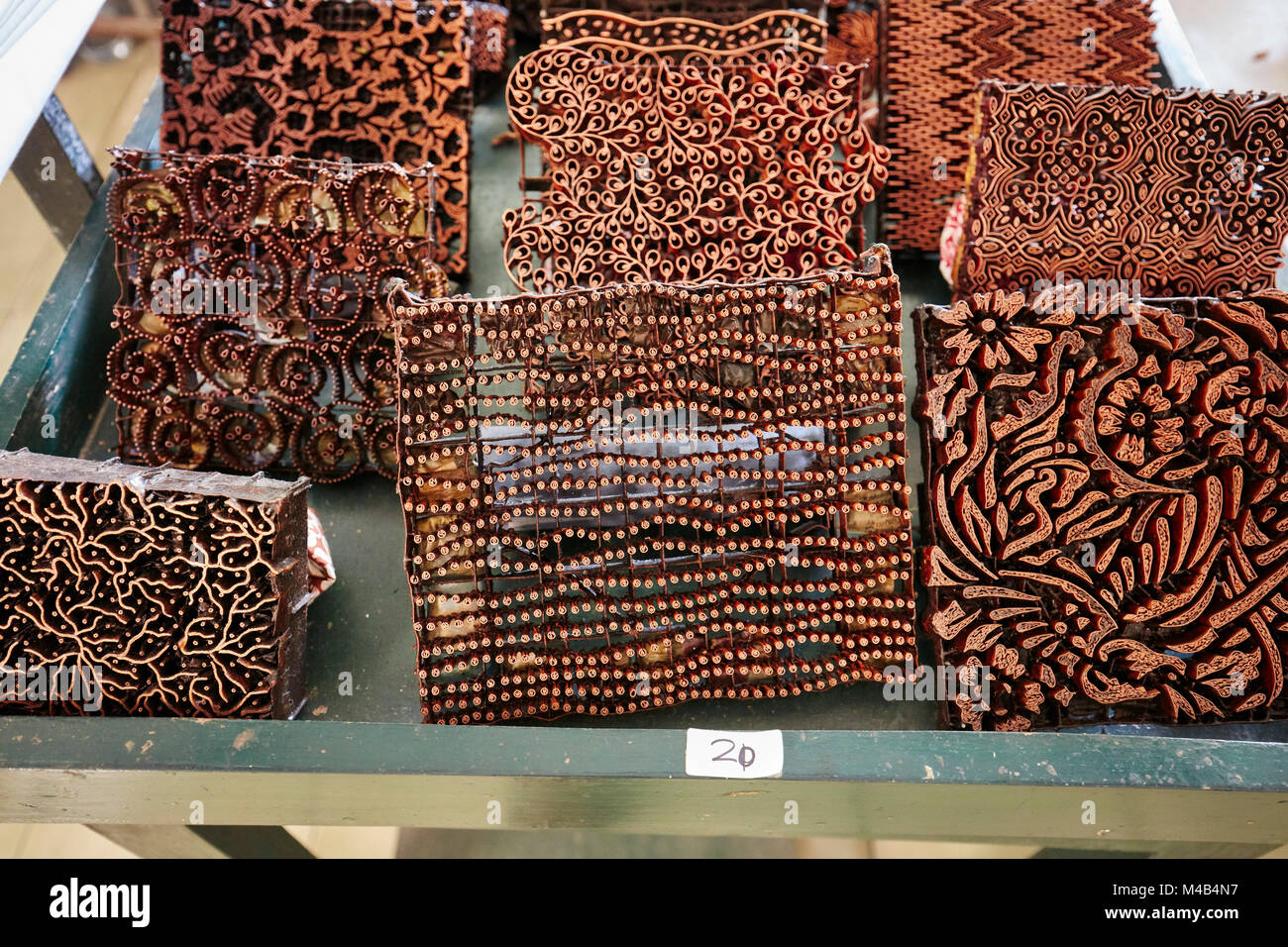 A selection of cap stamps, copper stamps used in batik production for ...