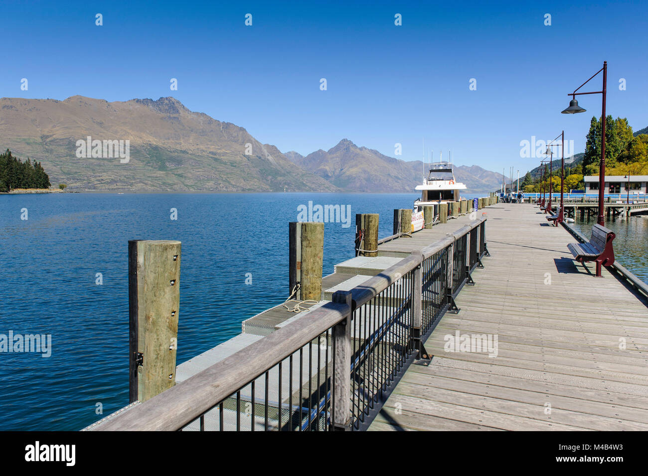 Wooden pier in queenstown hi-res stock photography and images - Alamy
