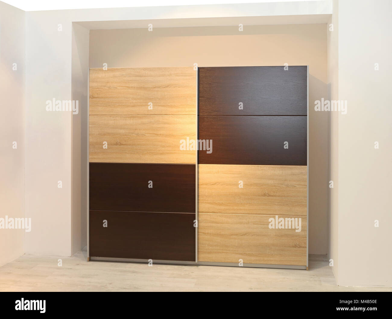 Big Wardrobe Closet With Wooden Doors in Bedroom Stock Photo - Alamy