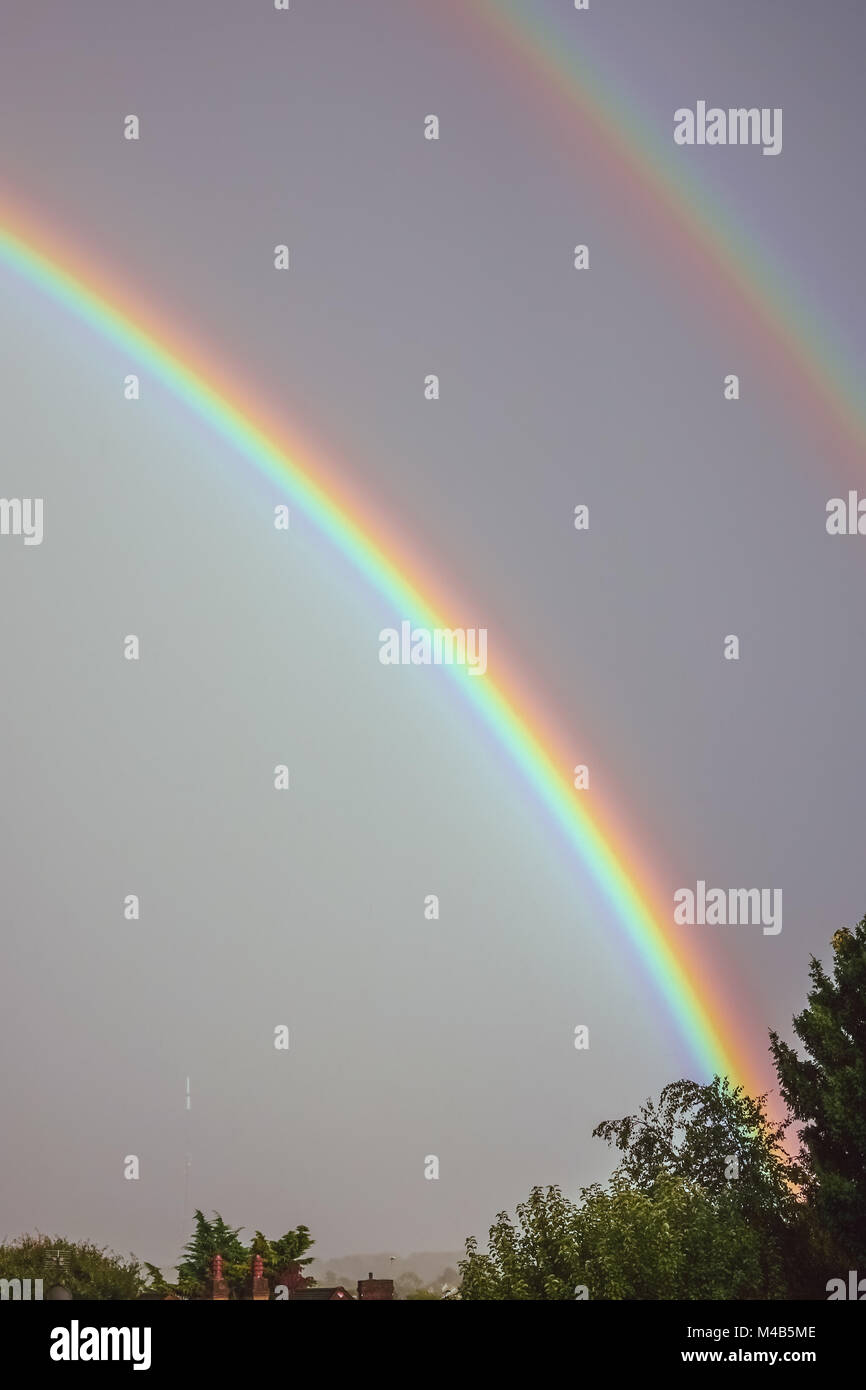 Two large rainbows Stock Photo - Alamy