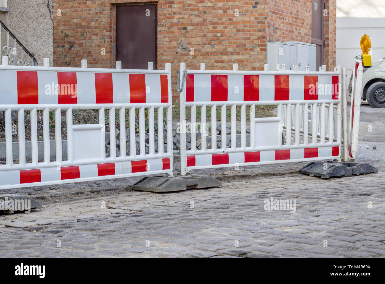 Construction site with barrier at a road Stock Photo - Alamy