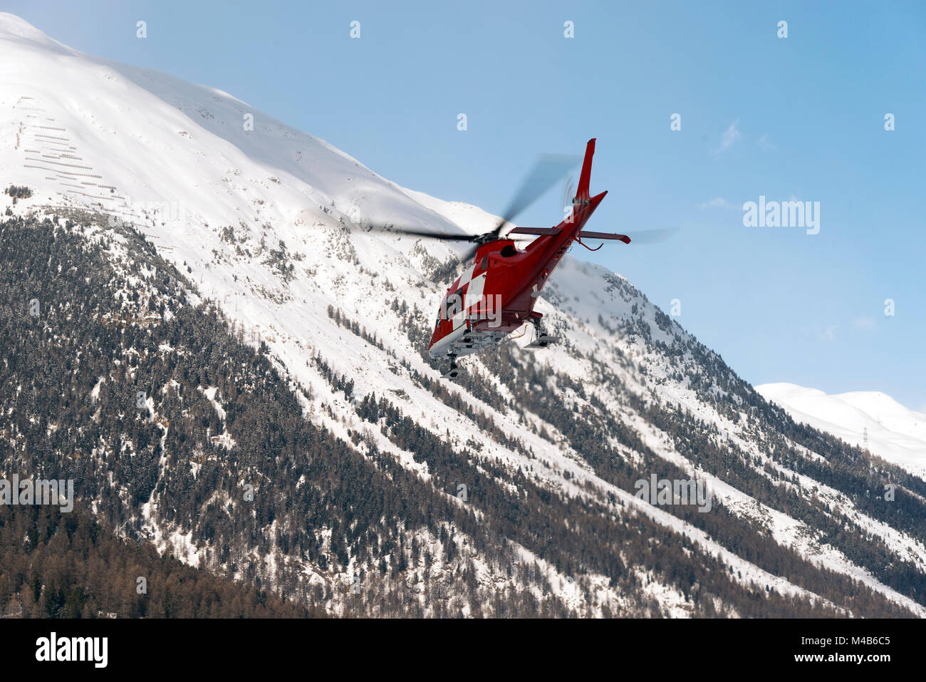 Red white helicopter snow mountains hi-res stock photography and images ...