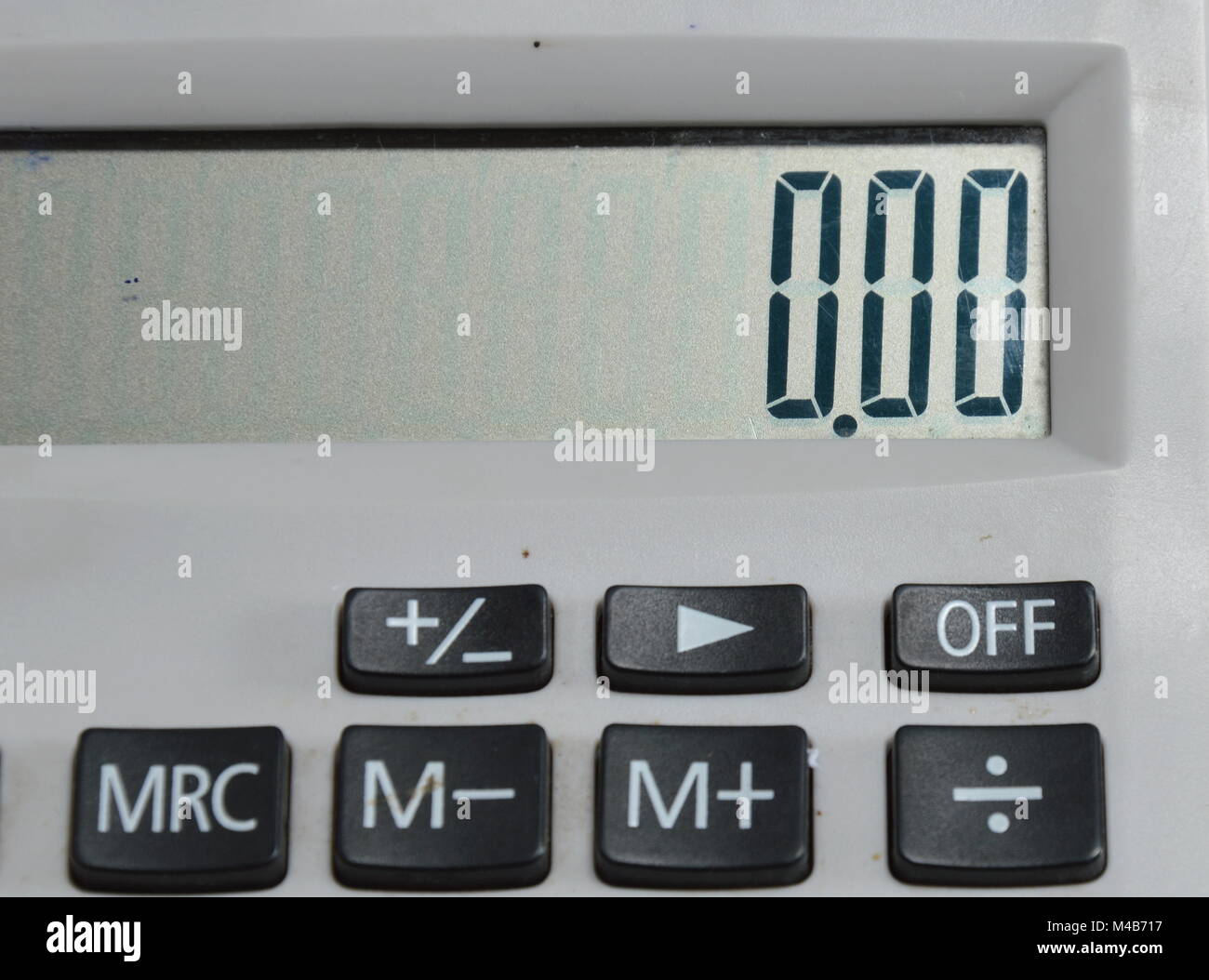 white calculator on wooden desk Stock Photo - Alamy
