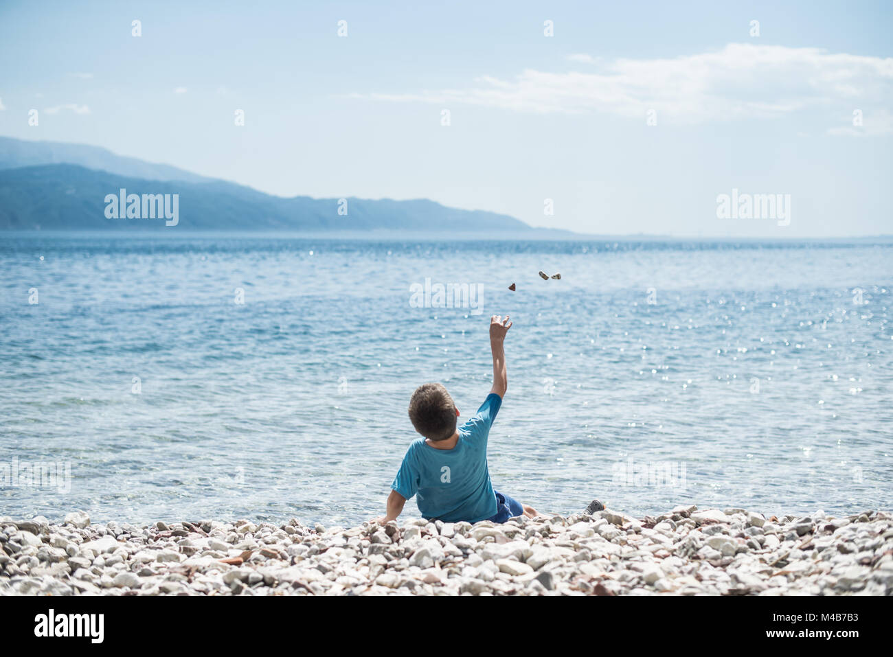 Throw rock water hi-res stock photography and images - Alamy