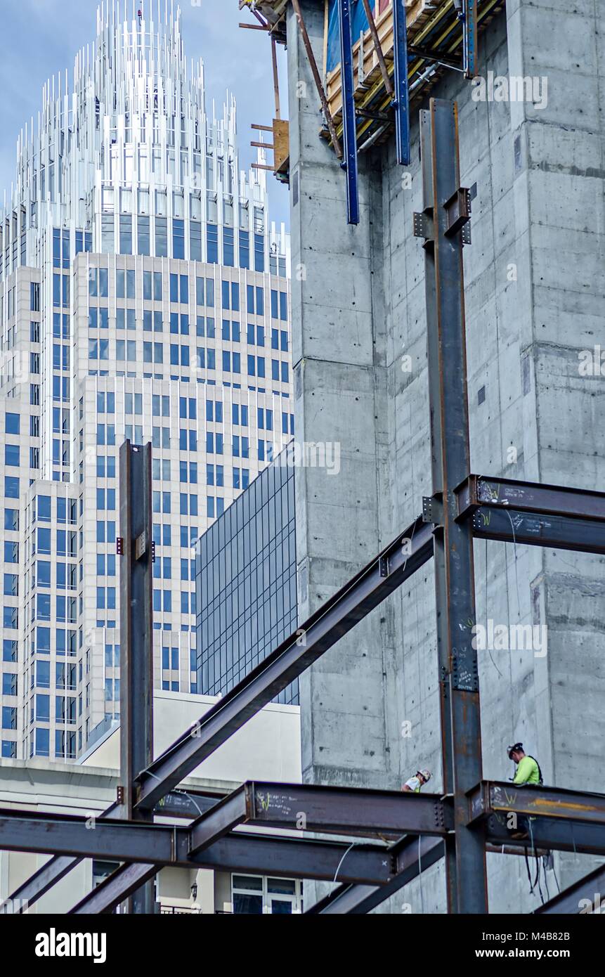 construction worker working on highrise building Stock Photo - Alamy