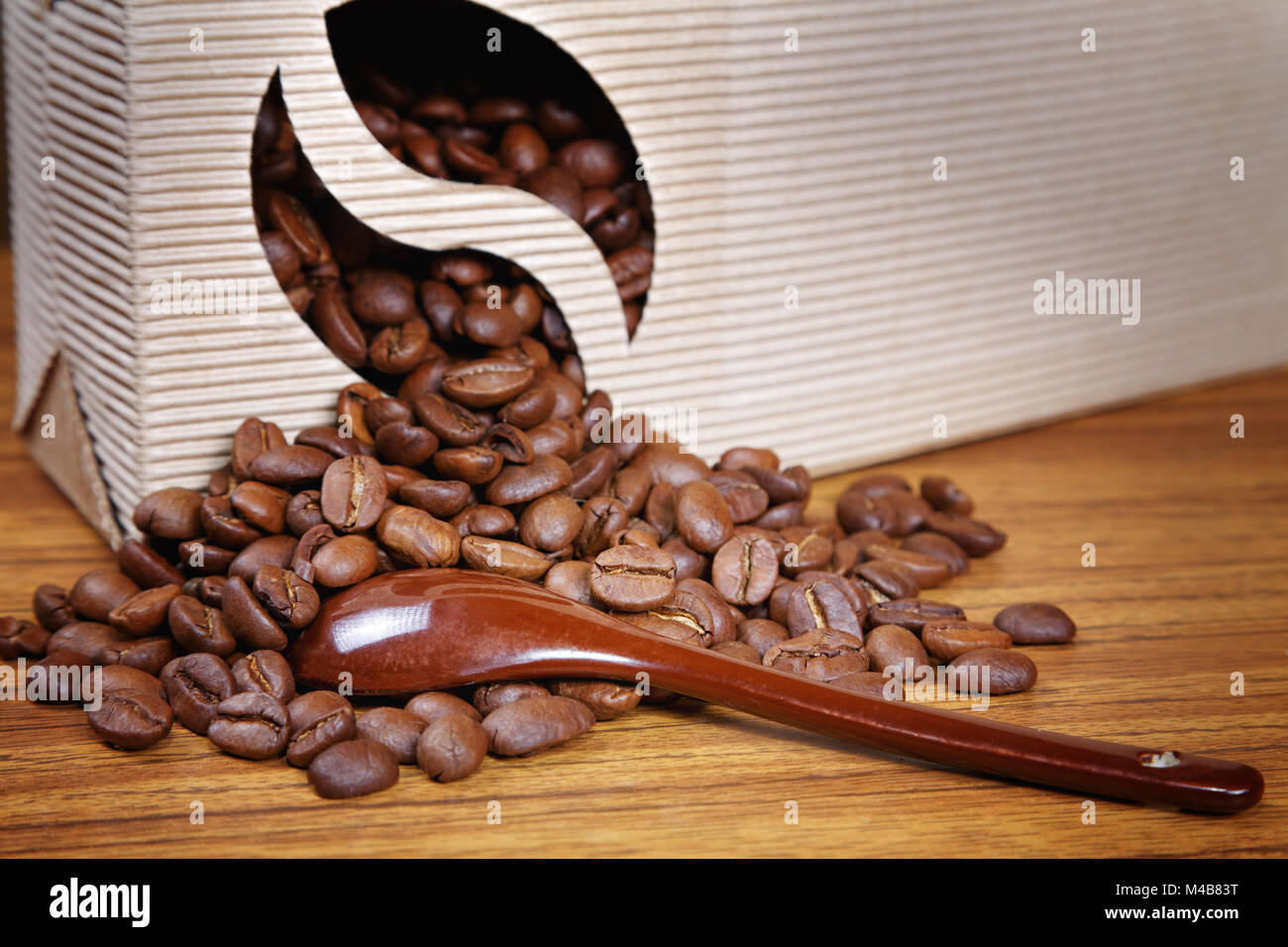 coffee beans spill out of the box on the table Stock Photo - Alamy