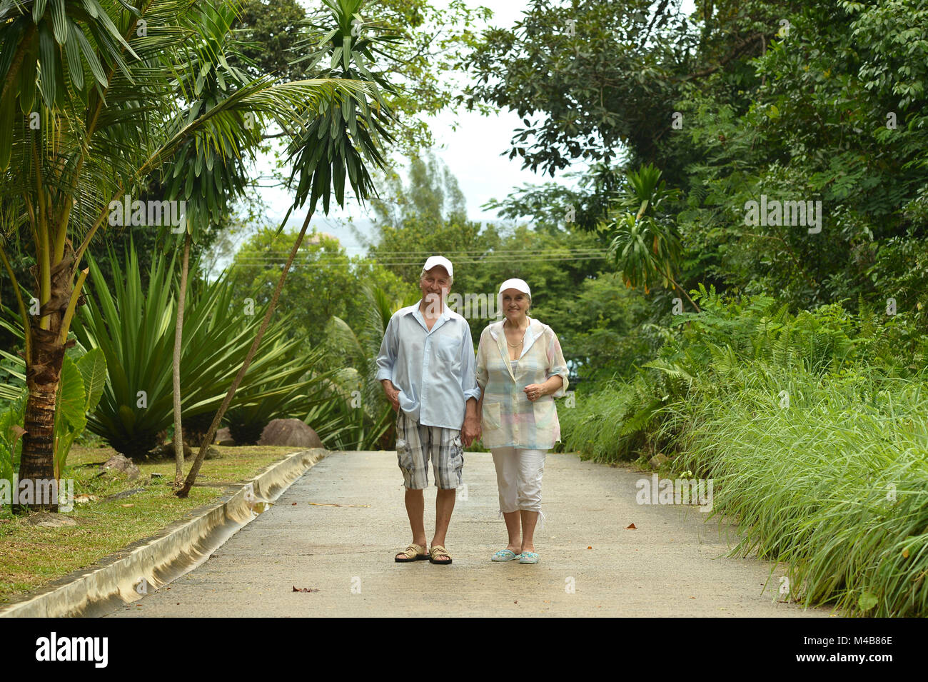elderly couple rest at tropical beach Stock Photo - Alamy