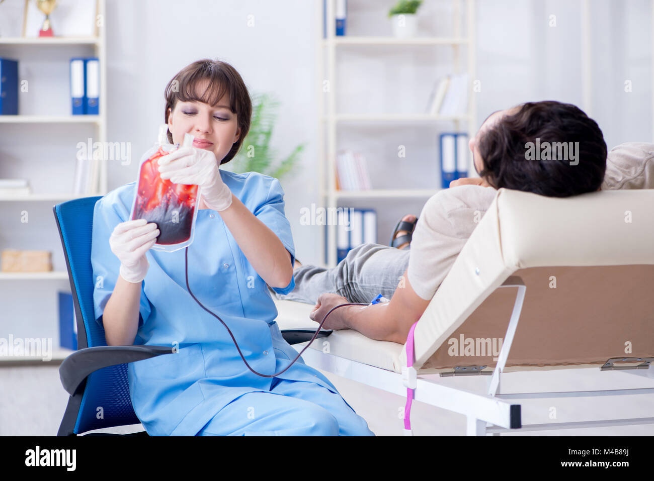 Patient getting blood transfusion in hospital clinic Stock Photo - Alamy