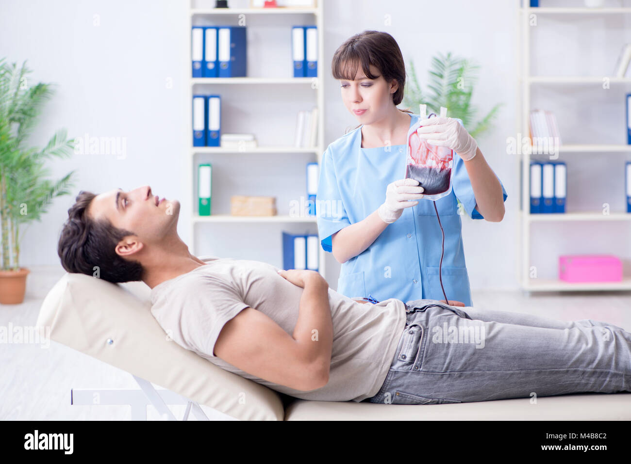 Patient getting blood transfusion in hospital clinic Stock Photo - Alamy