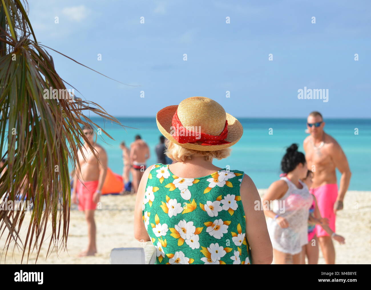 Senior woman sunbathing pool hi-res stock photography and images - Alamy