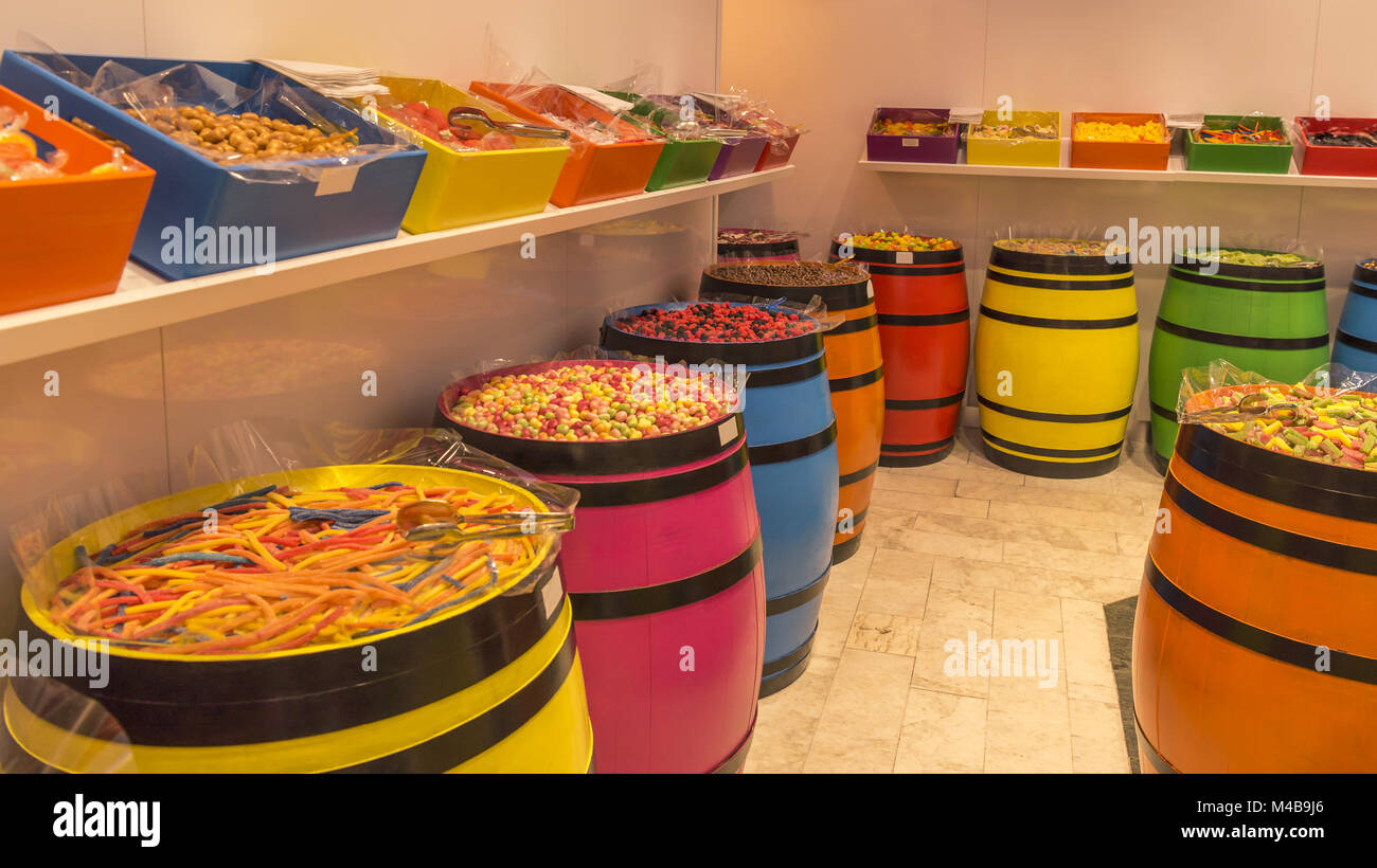 Wooden barrels filled with colorful candies Stock Photo - Alamy