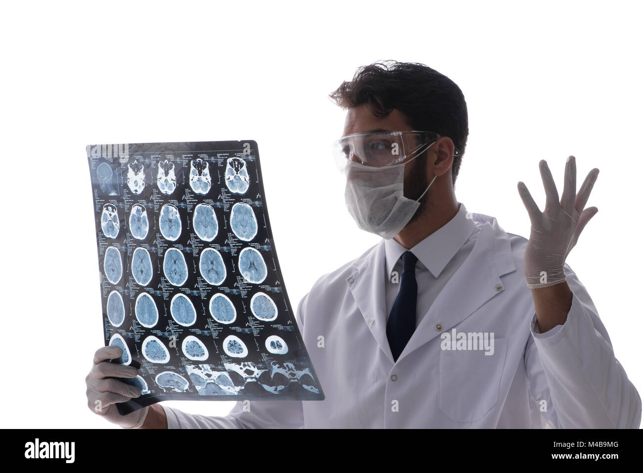 Young doctor looking at x-ray images isolated on white Stock Photo - Alamy