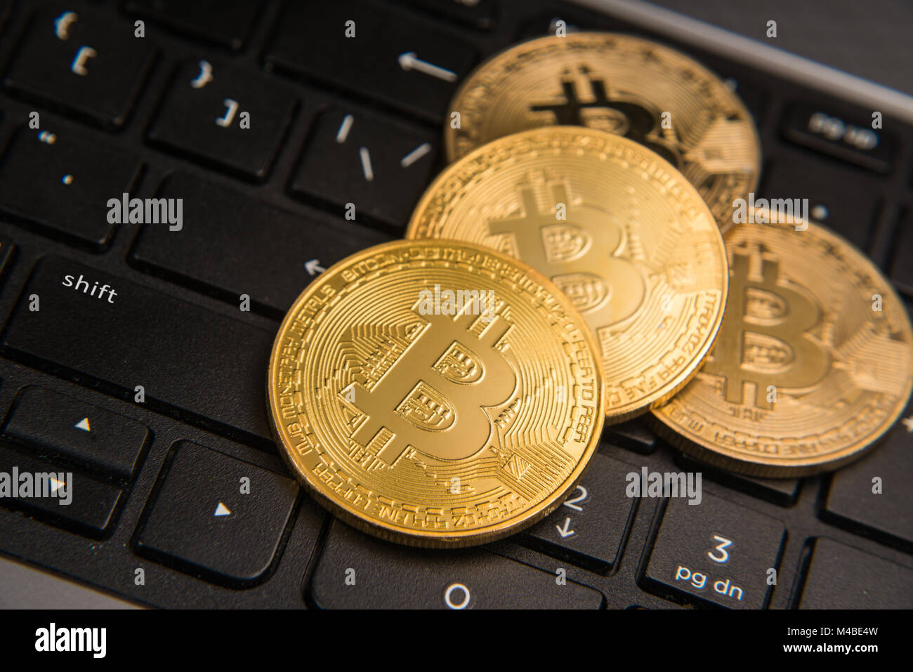 Bitcoin coins on computer hi-res stock photography and images - Alamy
