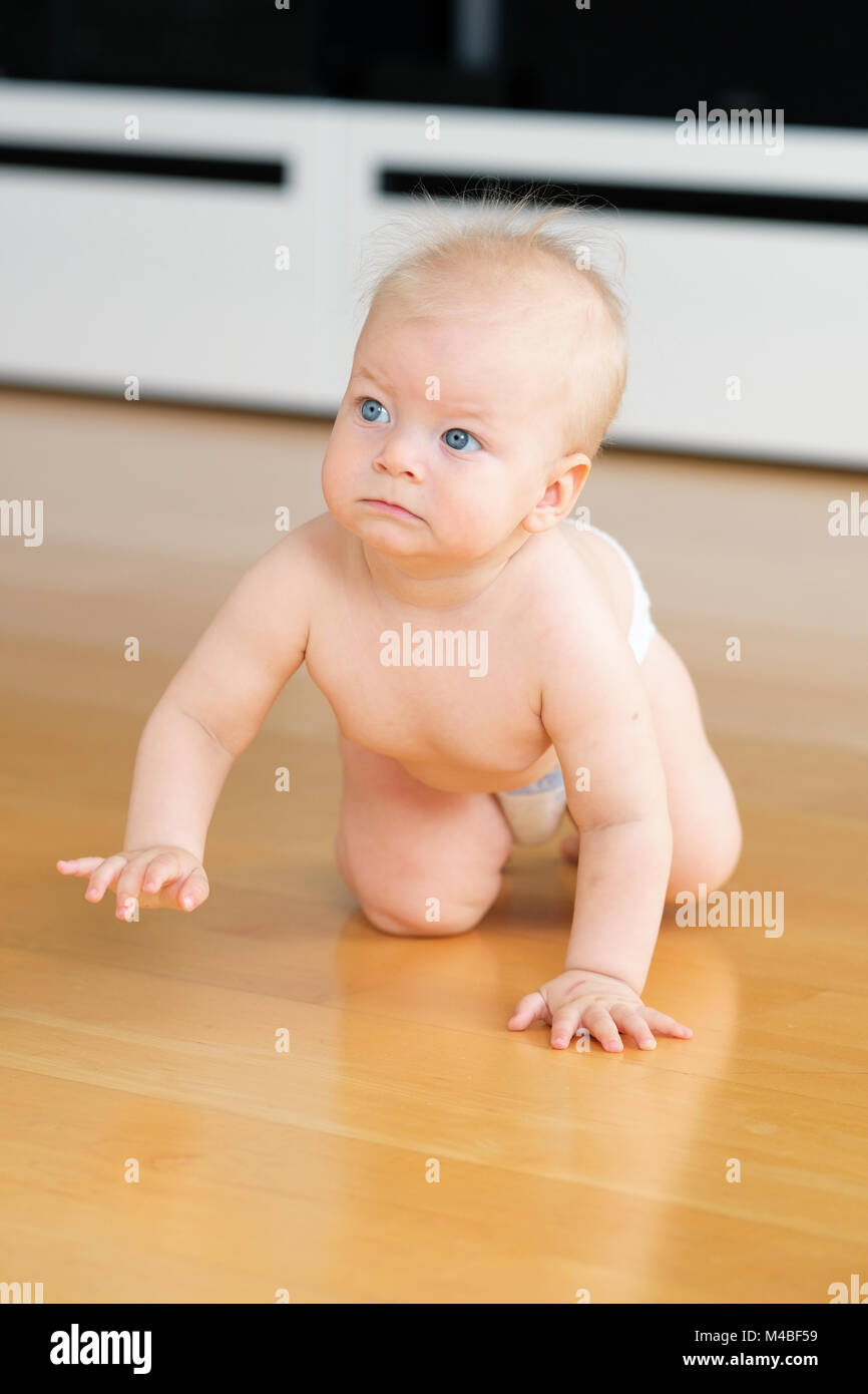Baby boy crawling Stock Photo - Alamy
