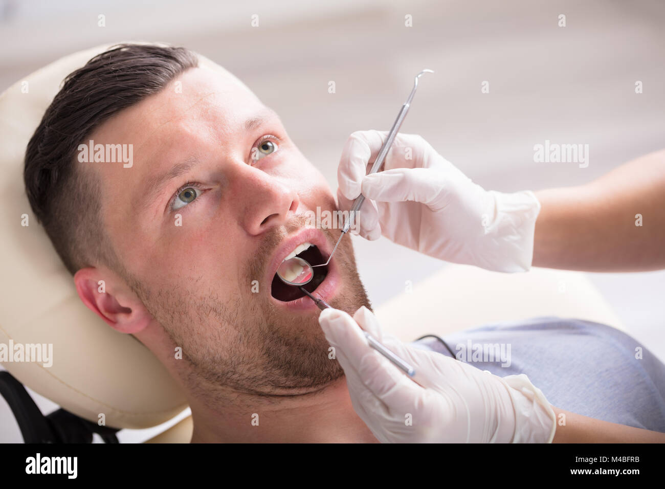 Close-up Of A Young Man Having His Dental Checkup In A Clinic Stock ...