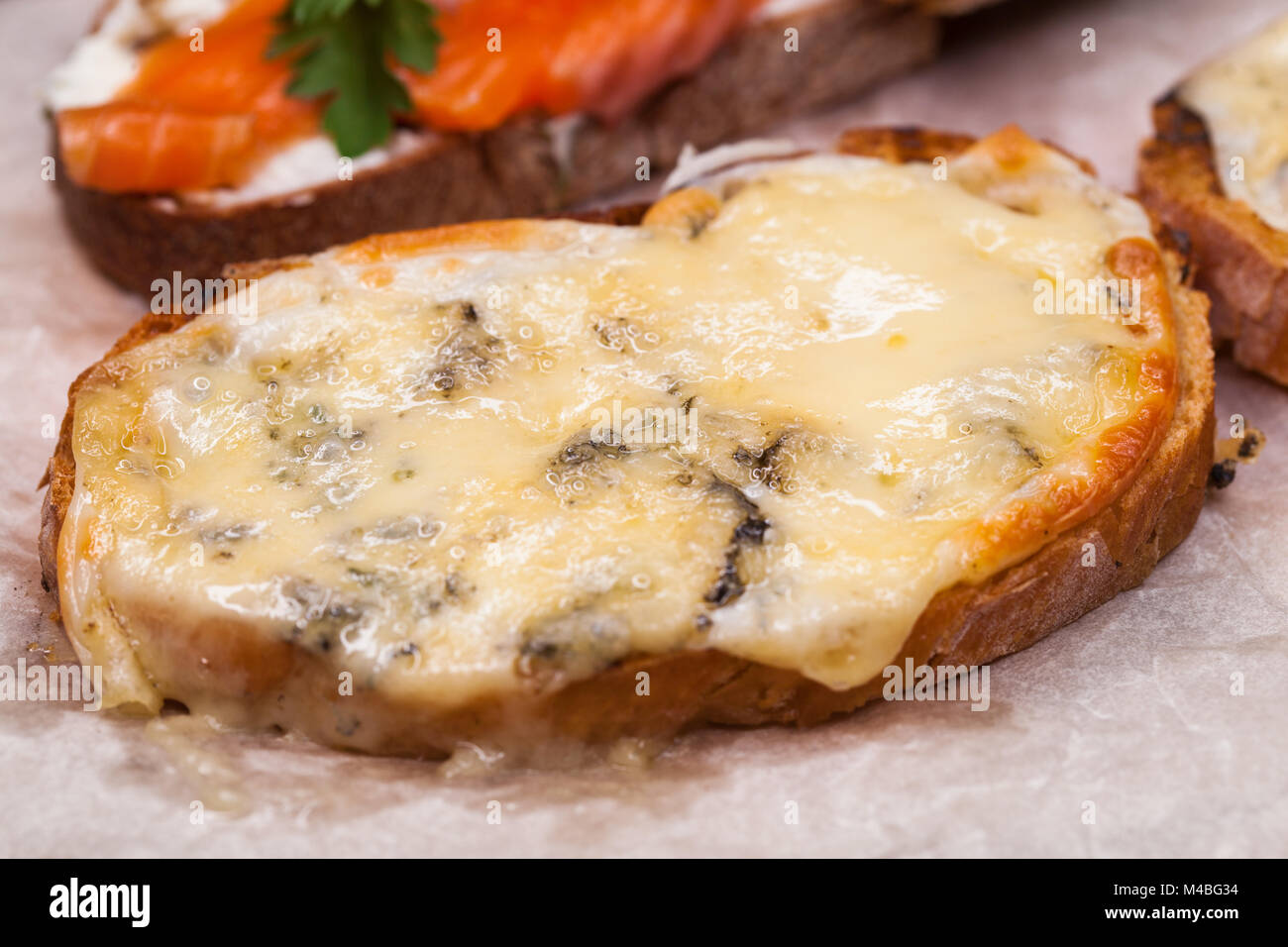 Toast with melted cheese, closeup Stock Photo - Alamy