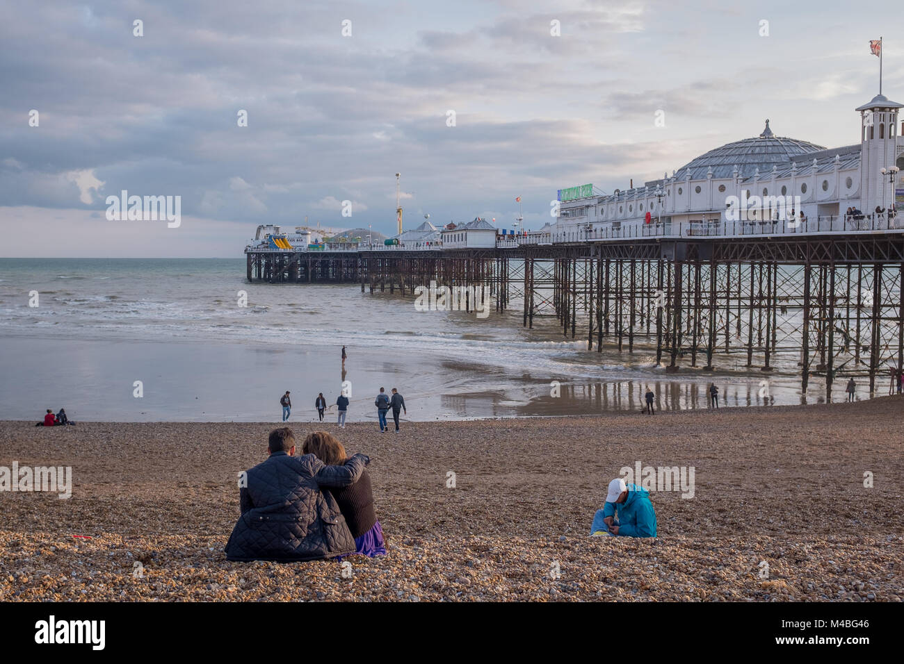 People relaxing on Brighton beach Stock Photo - Alamy