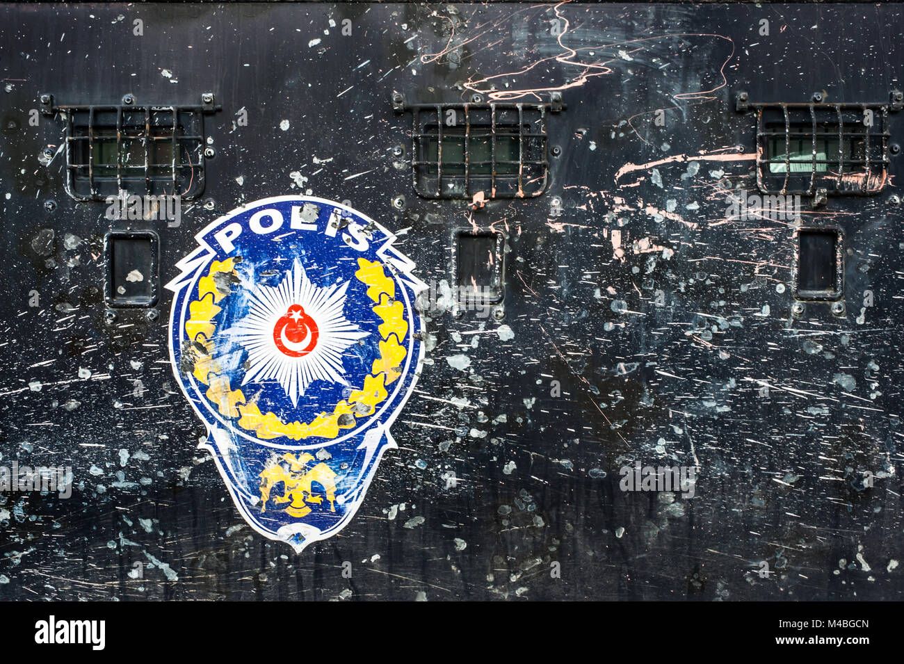 A Turkish armoured police vehicle exhibits signs of protest, in the ...