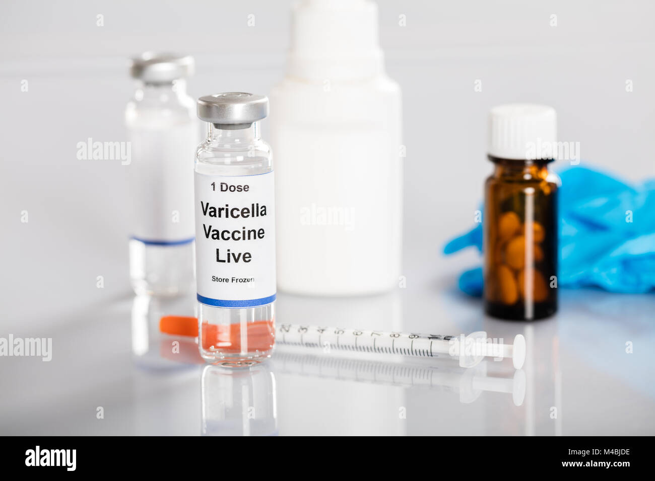 Varicella Vaccine In Vial With Syringe And Medicines Stock Photo - Alamy