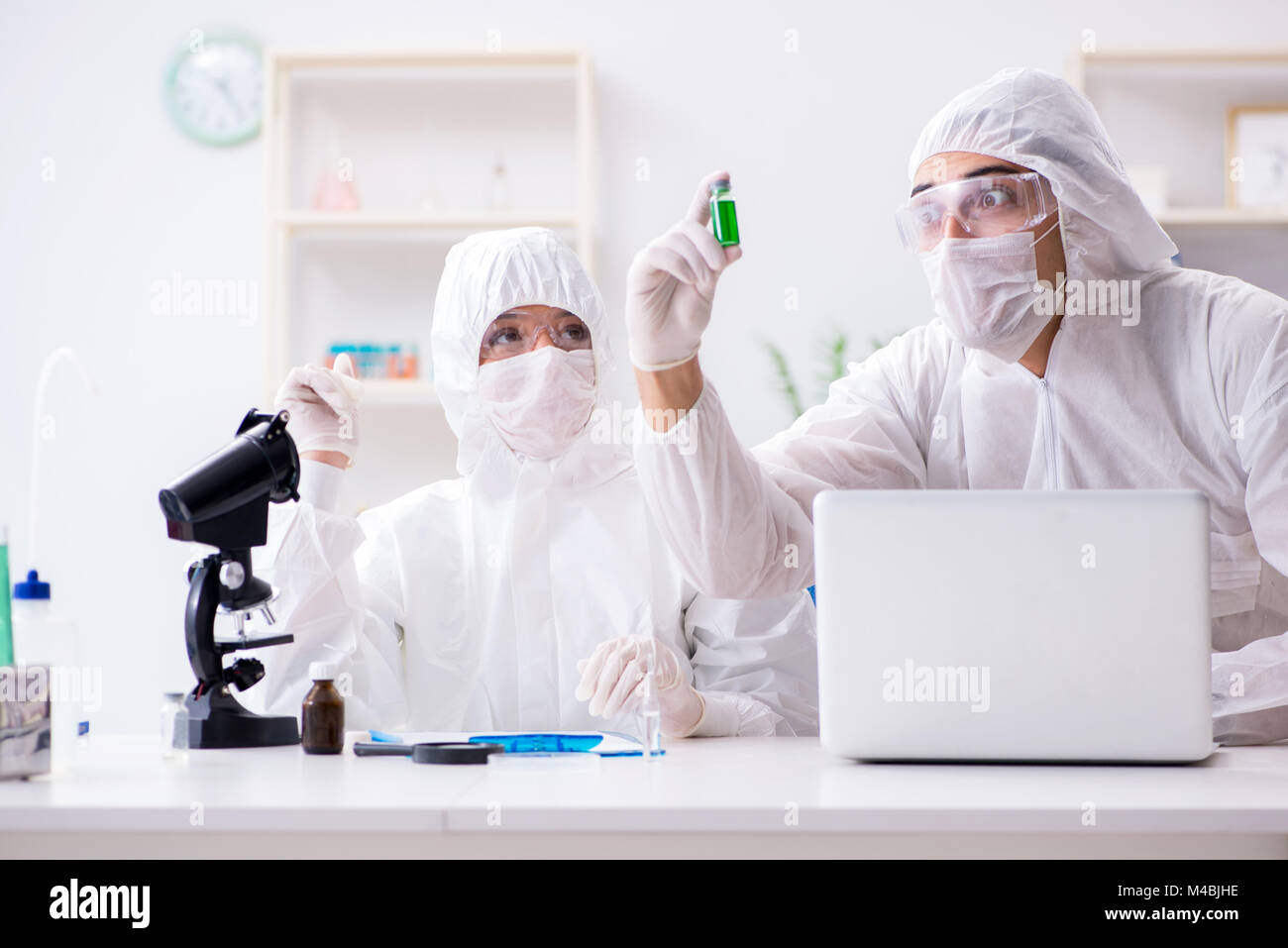 Two chemists working in the lab Stock Photo - Alamy
