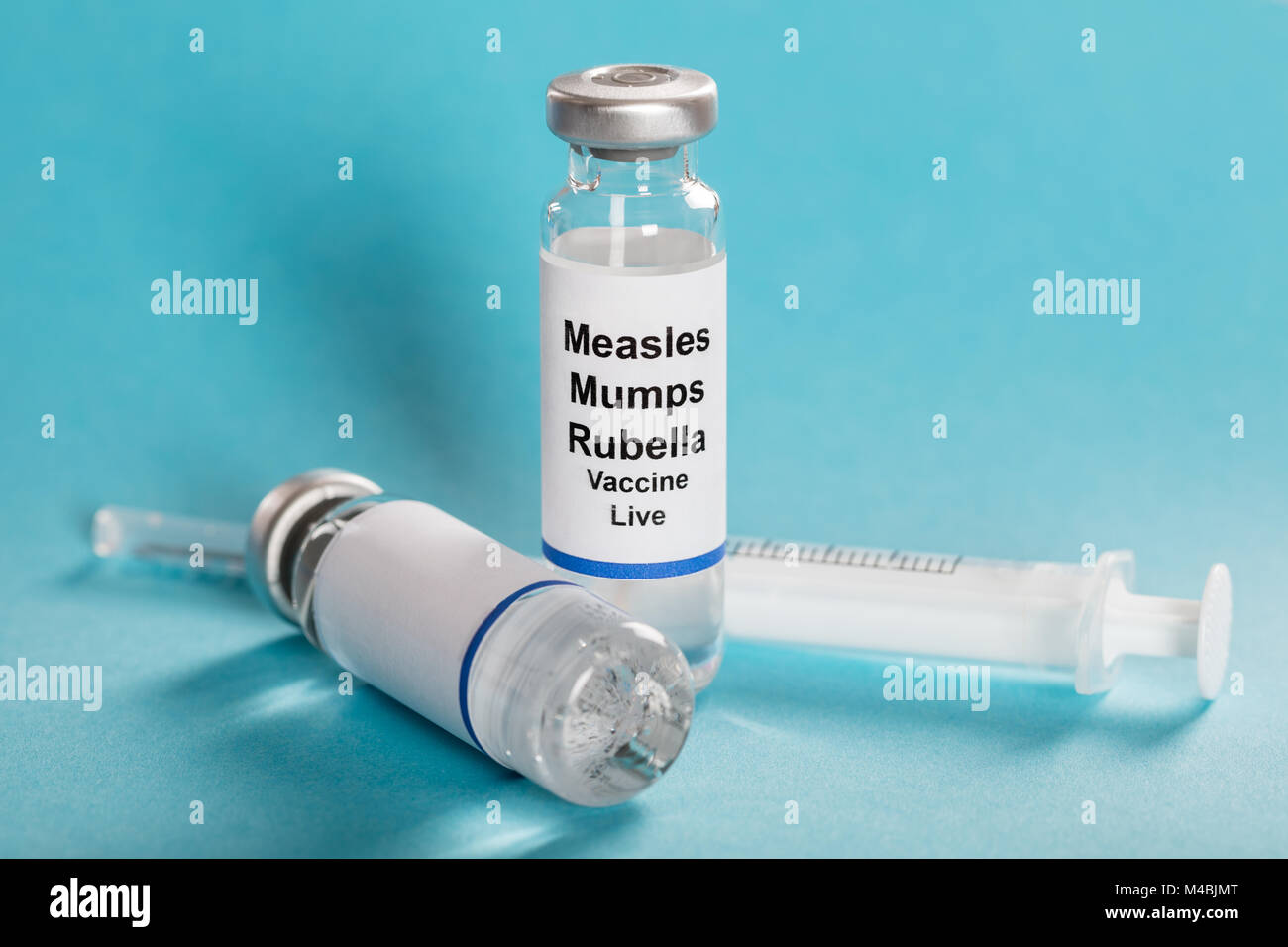Measles Mumps Rubella Vaccine Vials With Syringe Over Turquoise ...
