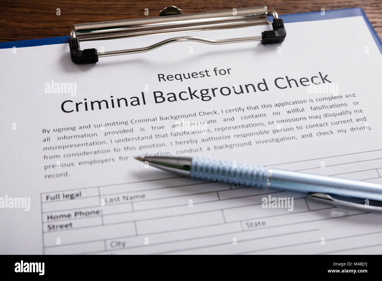 Close-up Of Criminal Background Check Application Form With Pen At Desk ...