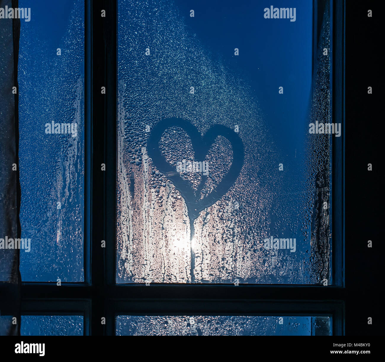 Moonlight through the window. Sweaty glass and heart Stock Photo - Alamy