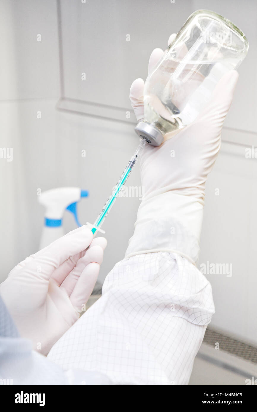 Doctor prepares patient injection hi-res stock photography and images ...