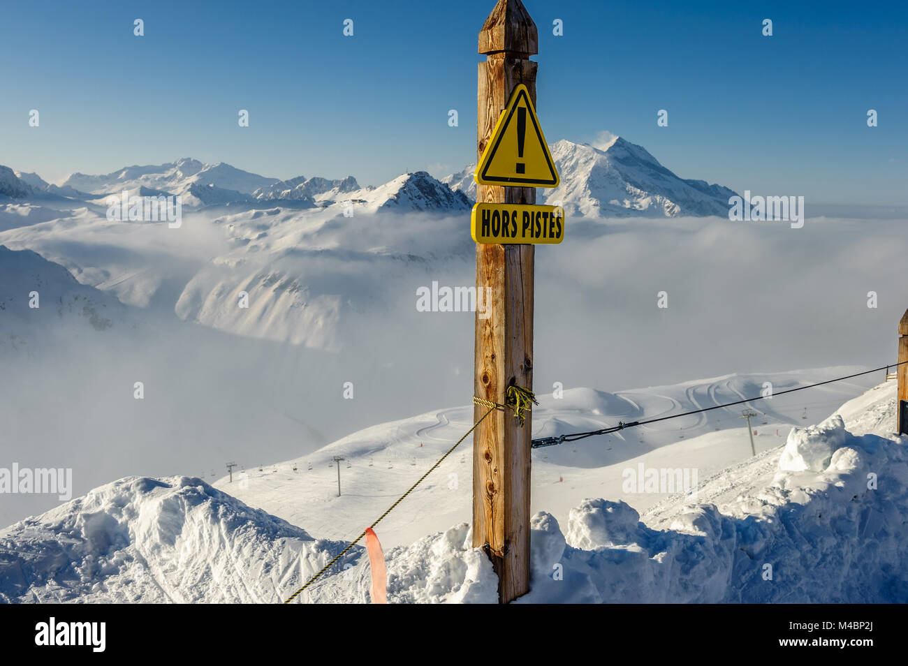 Off-piste sign at mountains in clouds with snow in winter Stock Photo ...